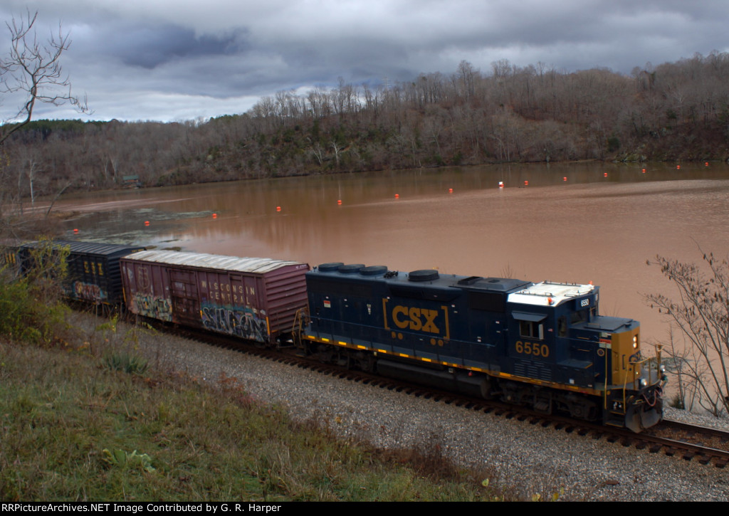 CSXT 6550 eastbound on local H74430. Muddy James River. Discharge from Judith Creek. 3" rain ...